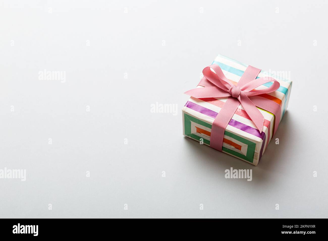 wrapped Christmas or other holiday handmade gift box in color paper ...
