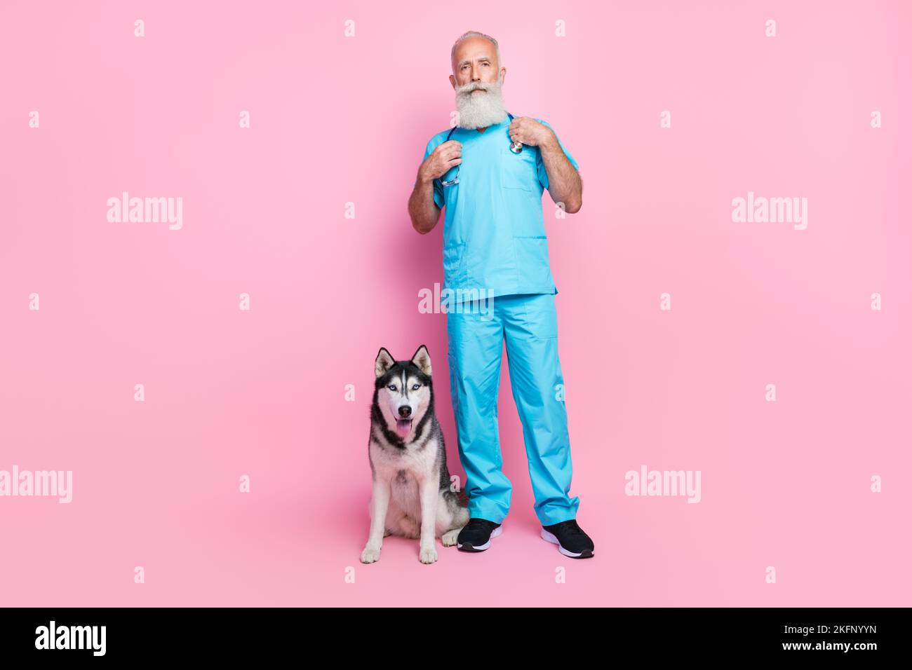 Full length photo of professional doctor dressed blue uniform hold ...