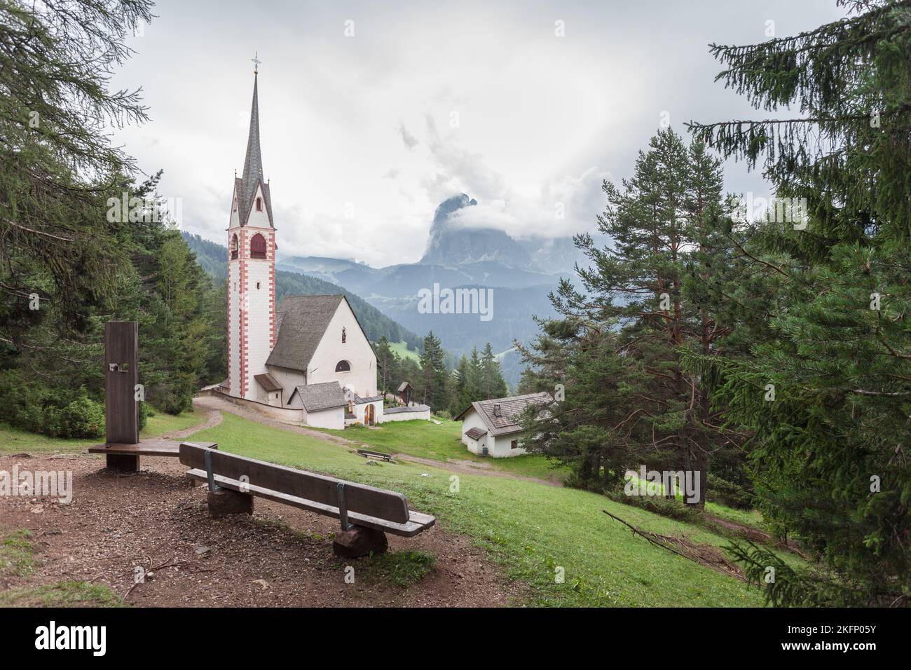 St. Giacomo little church among a wide green woods in Val Gardena area ...