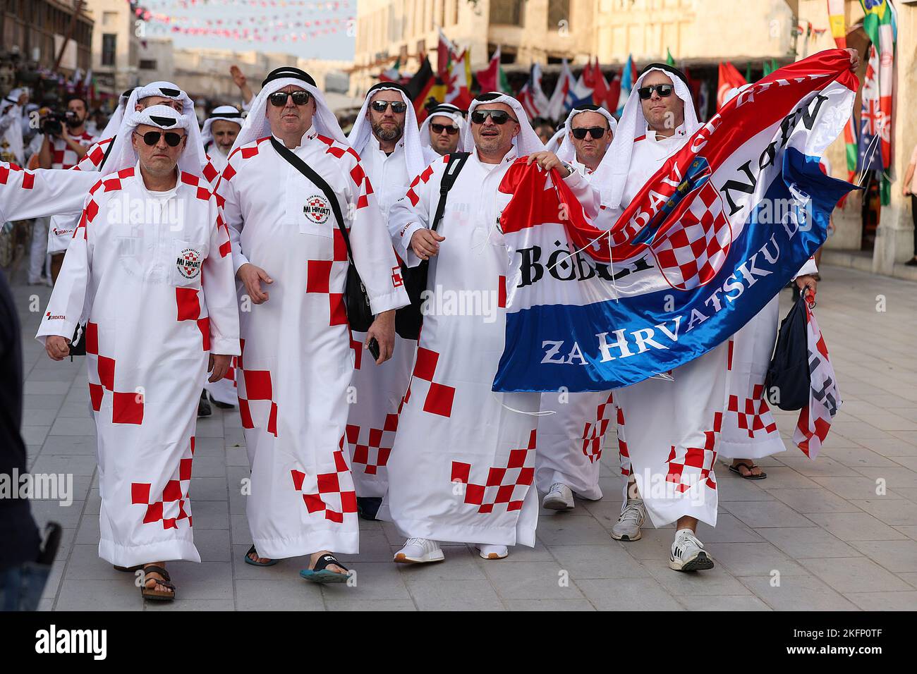 Doha, Qatar on November 19, 2022. Croatian fans in traditional Qatari ...