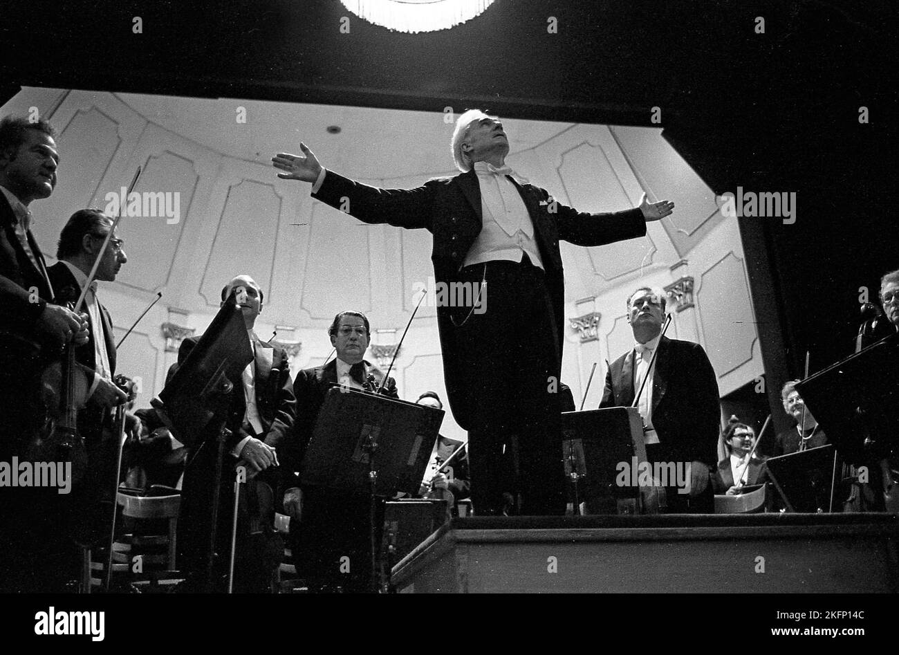 Jean Martinon, French orchestra conductor, during a performance with ...