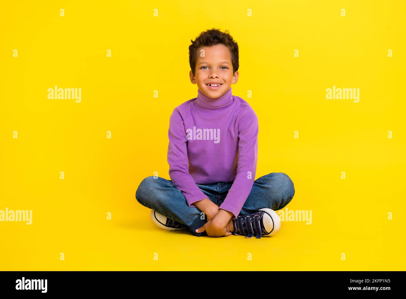 Full size photo of cheerful positive boy sit floor toothy smile good ...