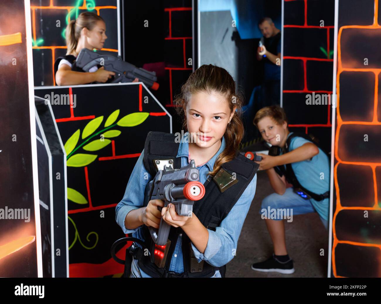 Portrait of teenager girl with laser gun having fun with her fam Stock ...