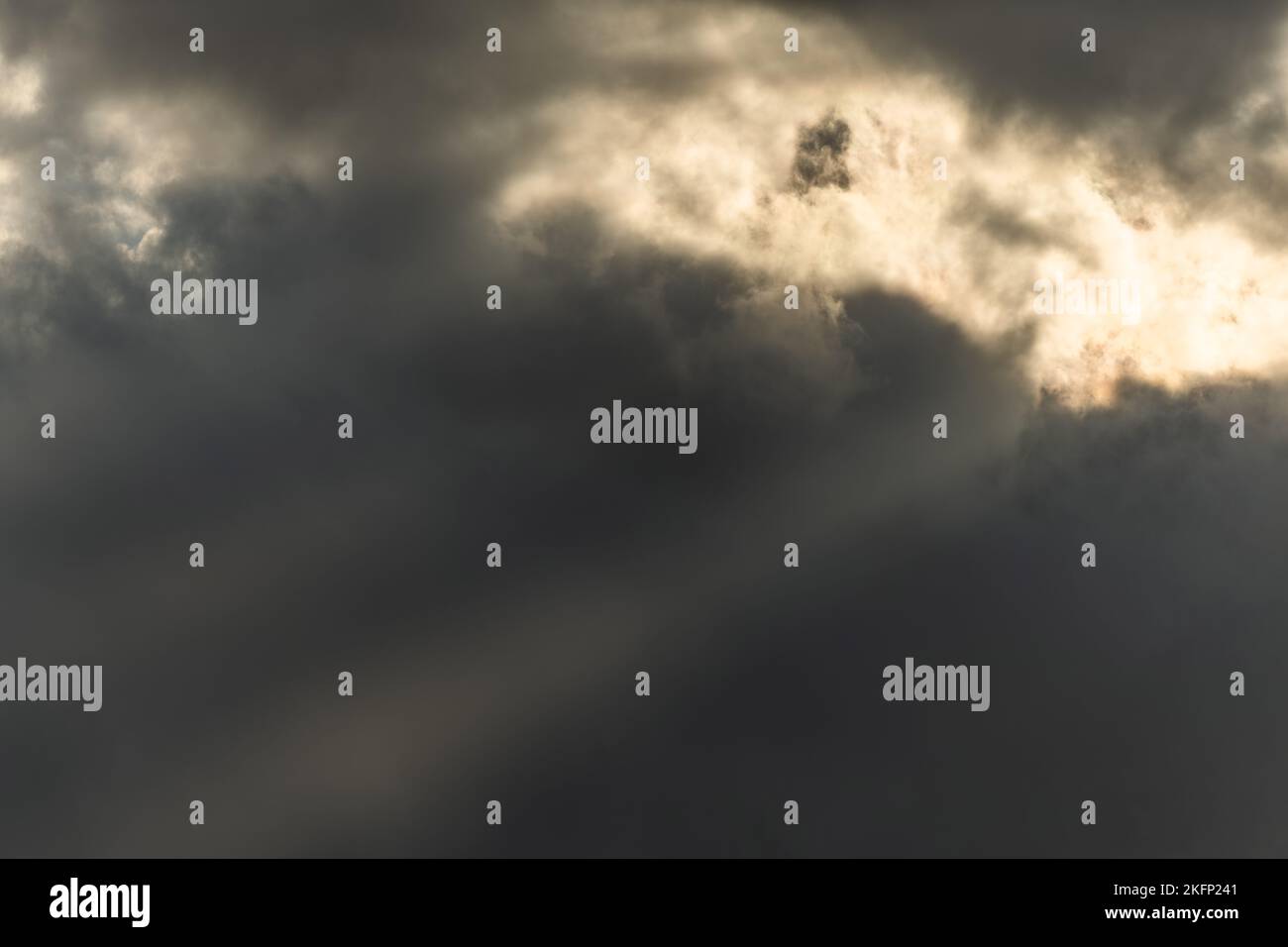 Beams of light of sun's rays through clouds in morning. Alsace, France ...