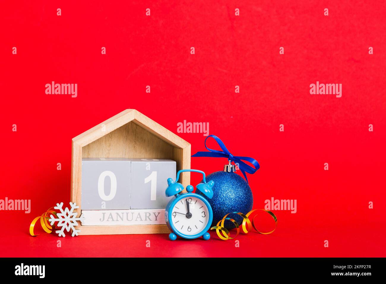 1 january. Christmas composition on colored background with a wooden ...