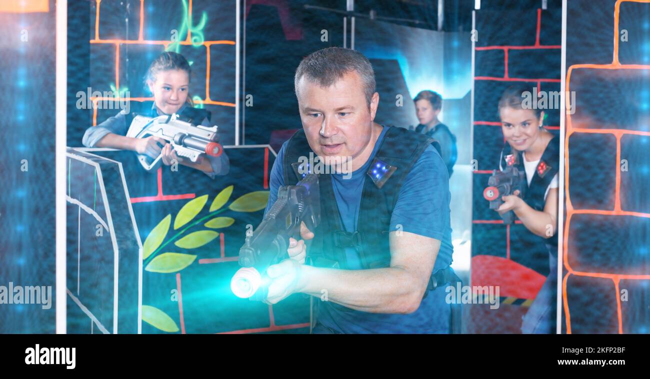 Man with laser pistol playing laser tag Stock Photo - Alamy