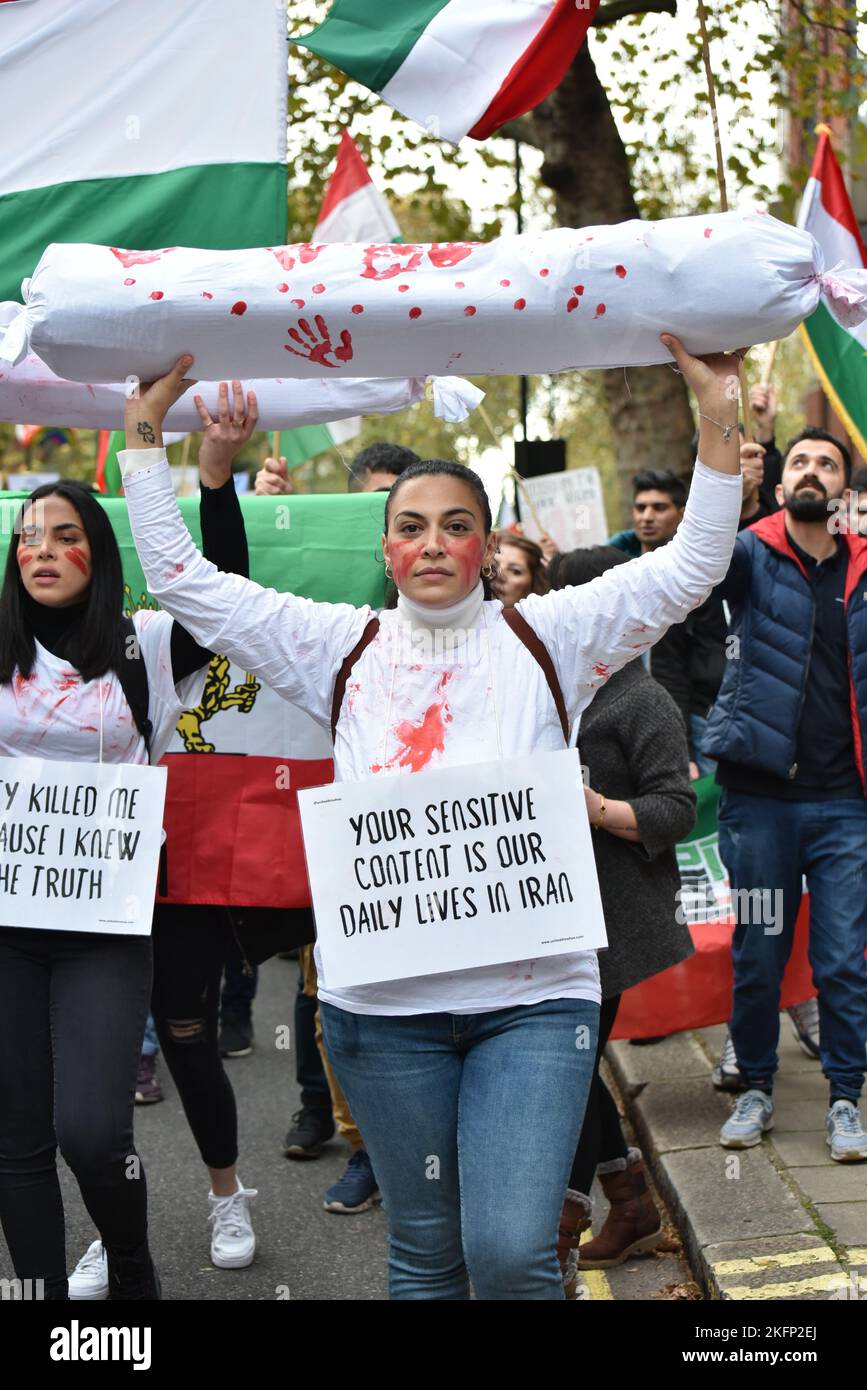 London, UK. 19 November 2022. Protesters march from the Iranian embassy ...