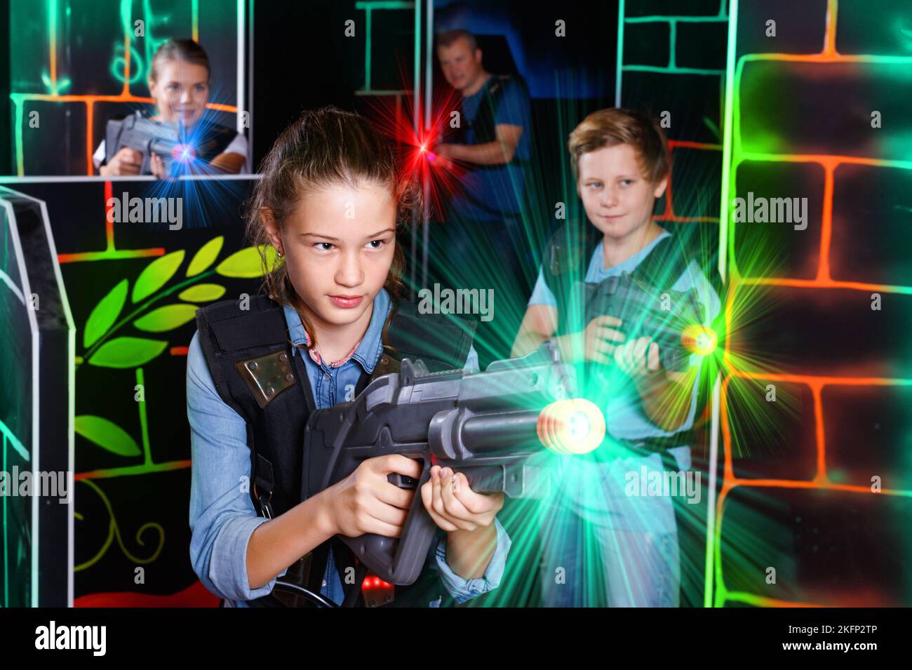 Portrait of teenager girl with laser gun having fun with her fam Stock ...