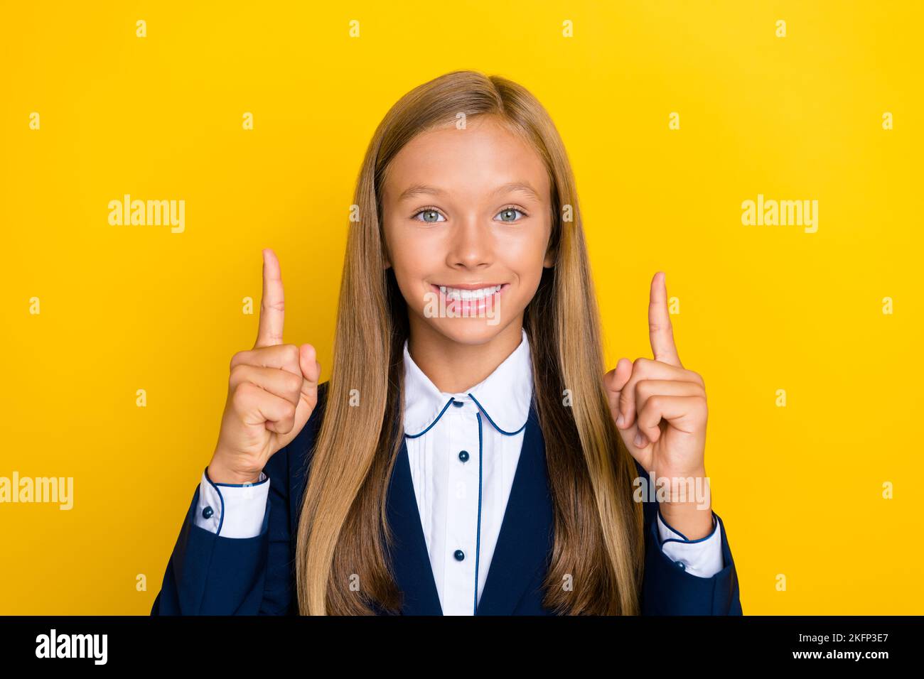 Photo of cheerful girl beaming smile hand demonstrate empty space big ...
