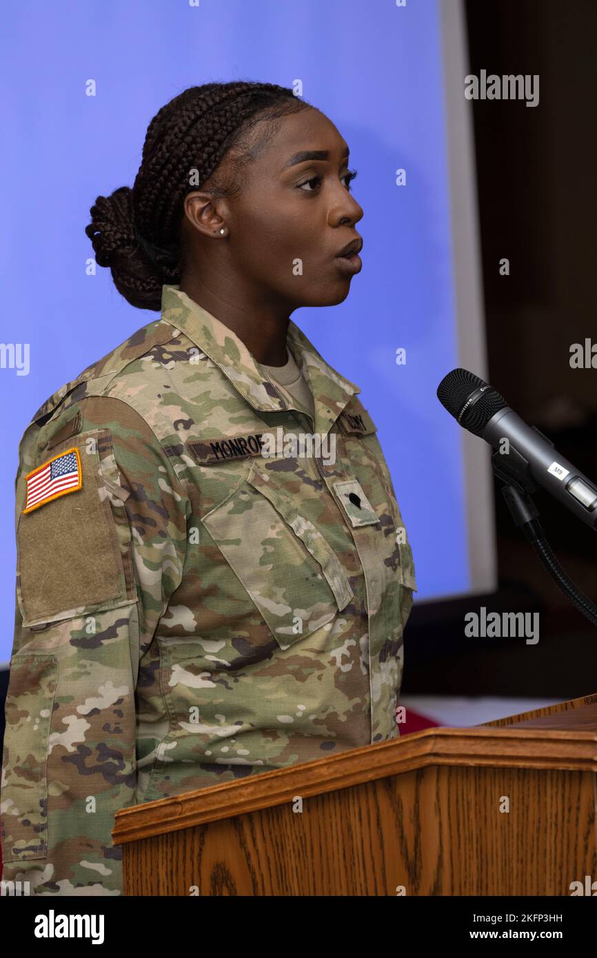 A vocalist with the 282nd Army Band sings the Star Spangled Banner ...