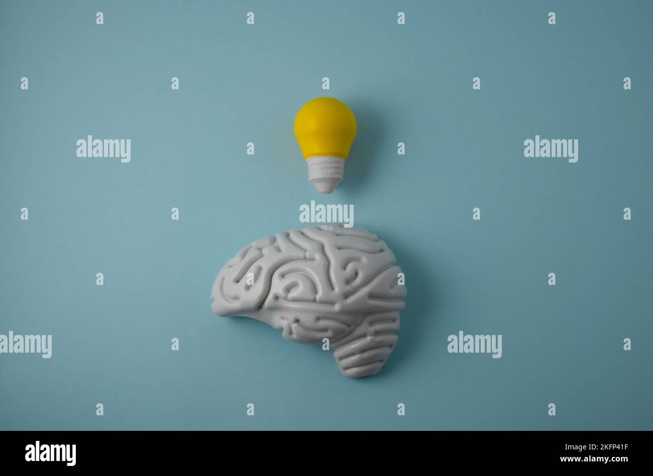 idea concept with toy brain with rubber bulb above on celestial ...