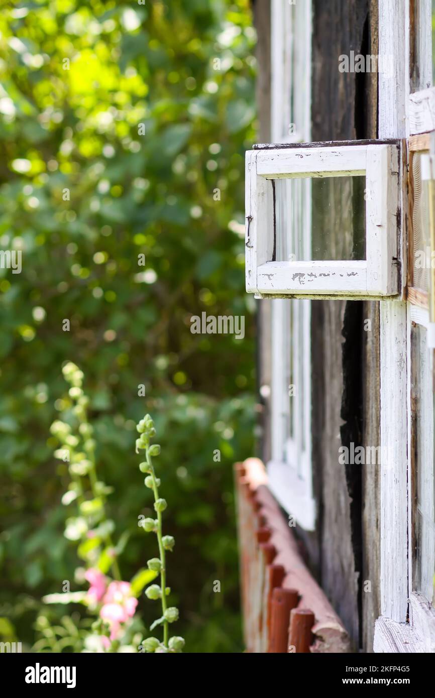 Exterior of the old wooden rural house. Sash window Stock Photo - Alamy