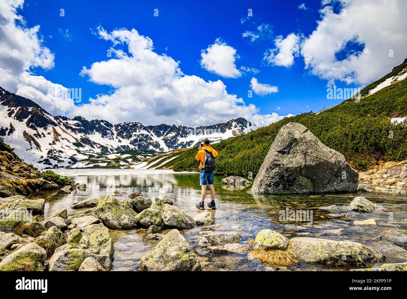 Solo traveler exploring charming Five Polish Ponds Valley Stock Photo ...