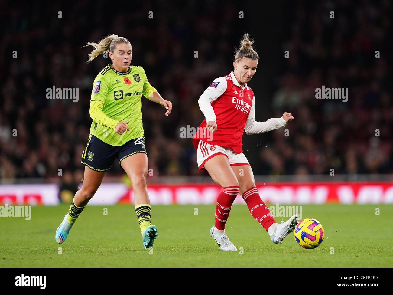 Manchester United's Alessia Russo (left) Arsenal's Stephanie Catley in ...