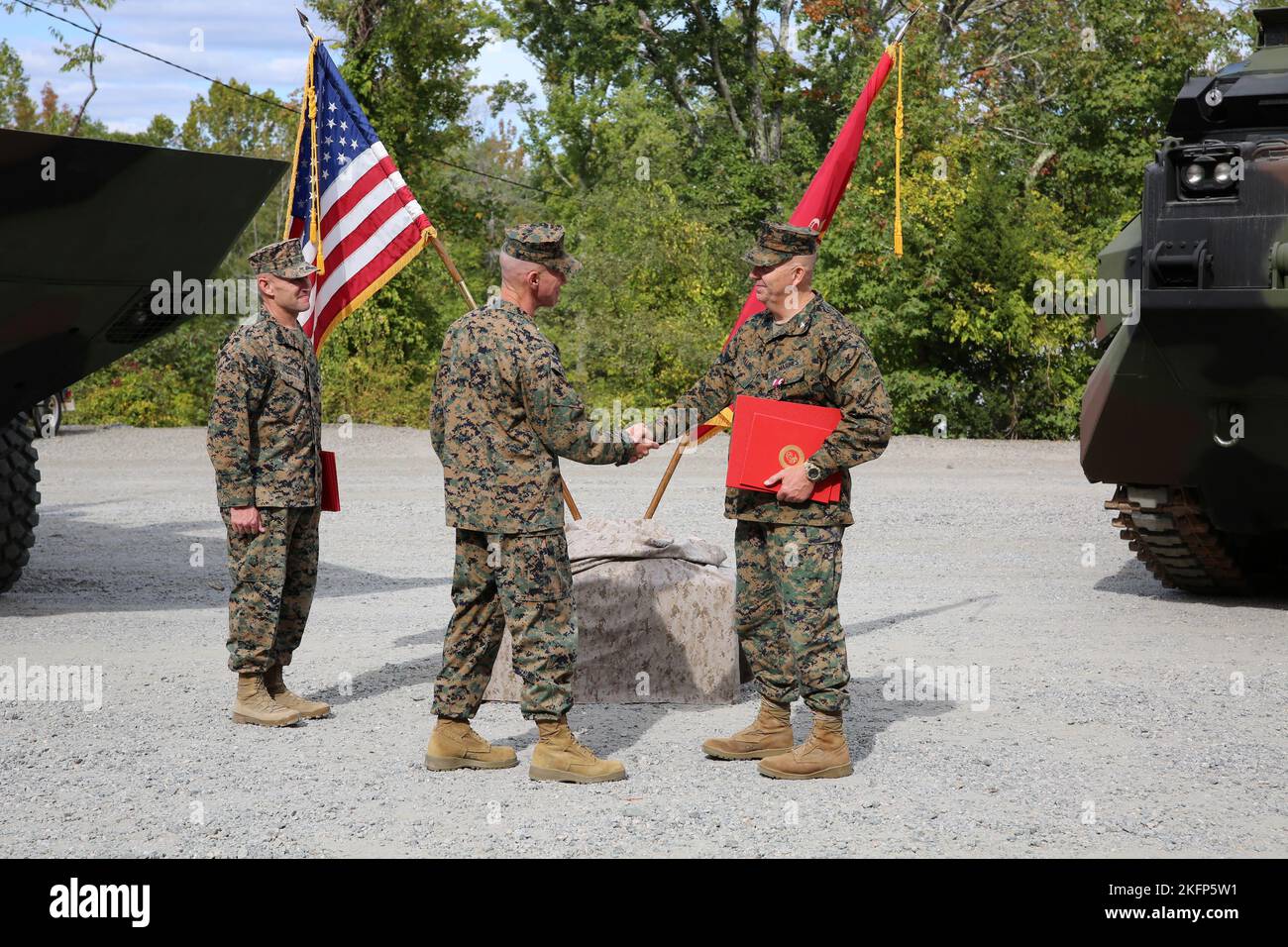 Marine Corps Systems Command Sgt. Maj. Allen Goodyear, left, looks on ...