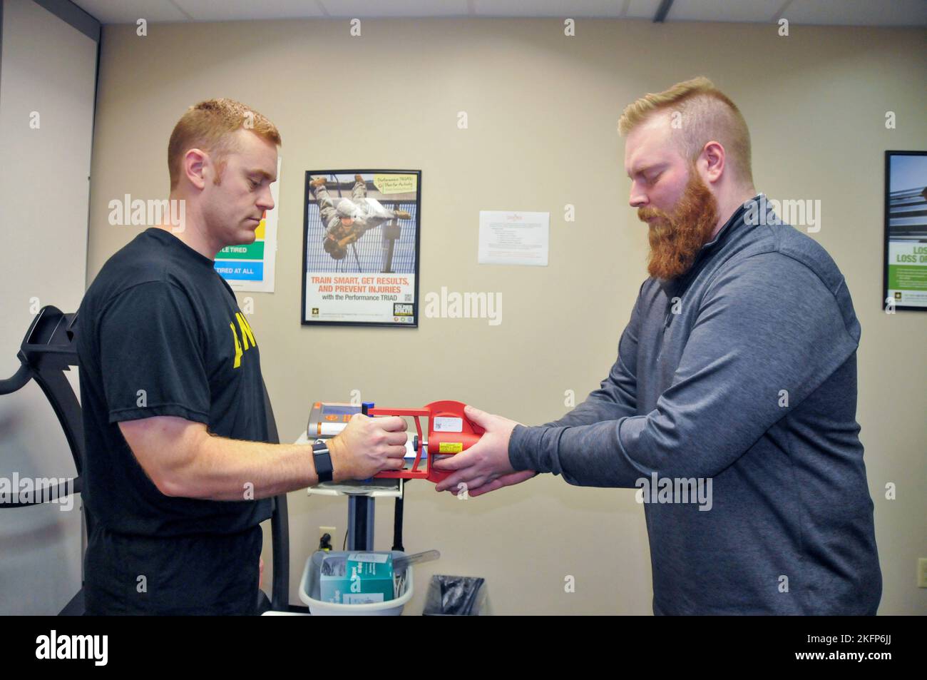 Cpt. Alex Purdy (left) completes a hand strength test as Drake Grinde ...