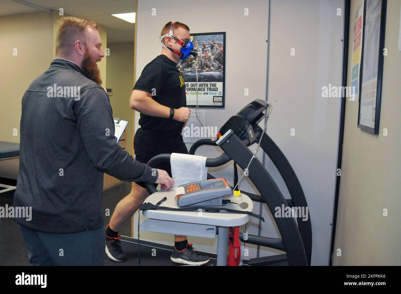 Cpt. Alex Purdy runs on the treadmill in order to test his breathing ...