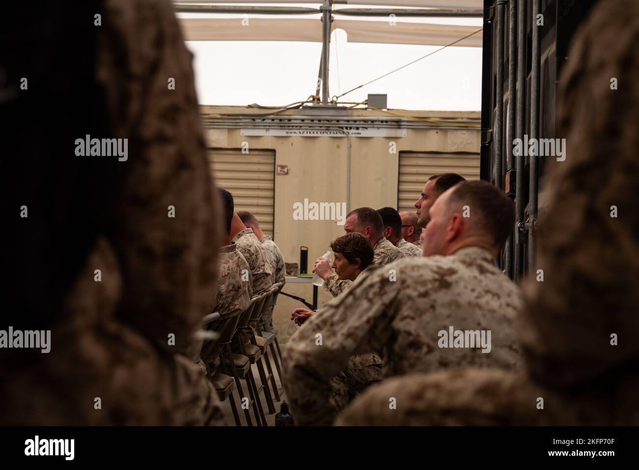 U.S. Marines observe as students present their logistics plans for a ...
