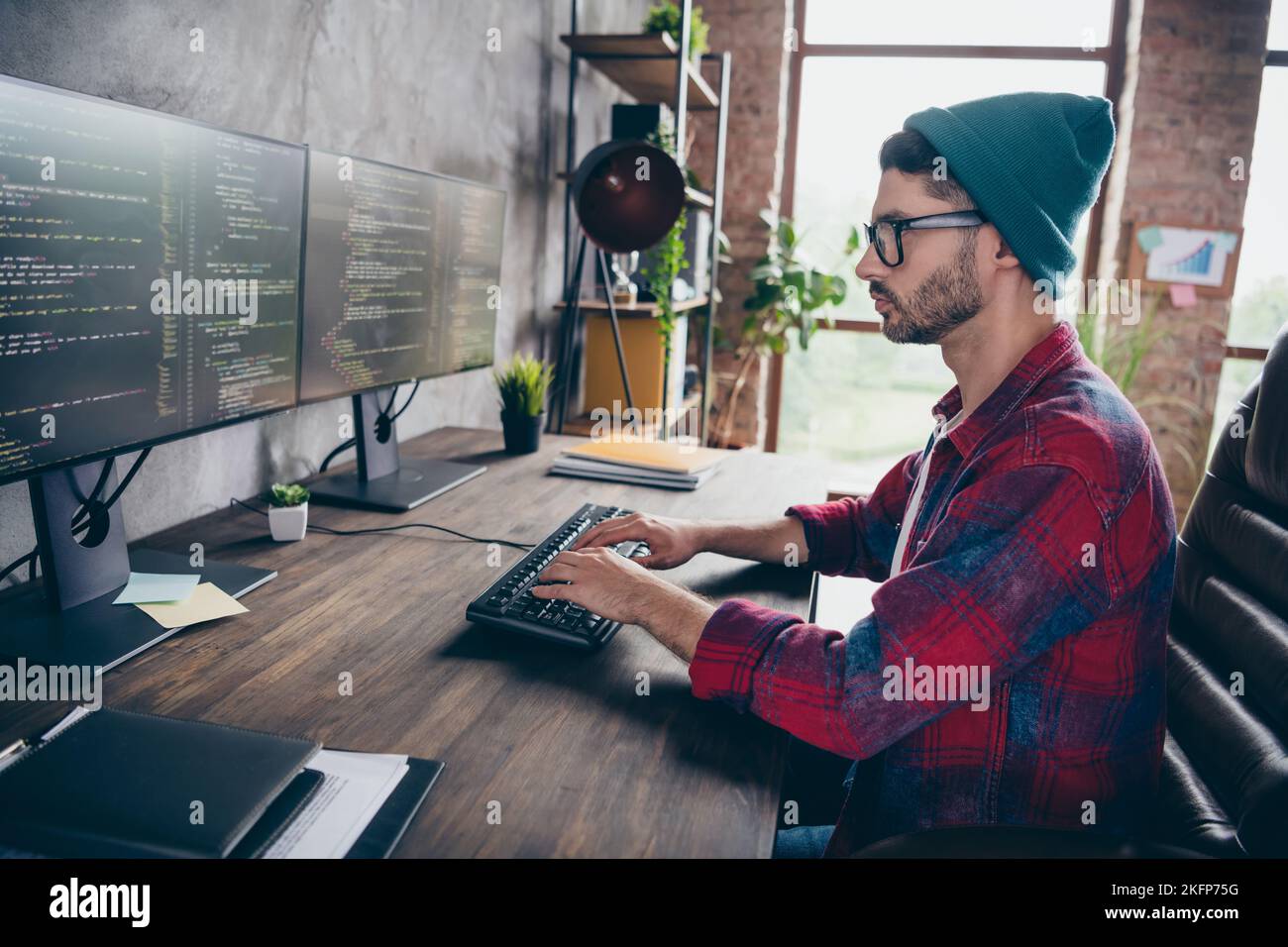Photo of cool intelligent programmer wear spectacles typing front end ...