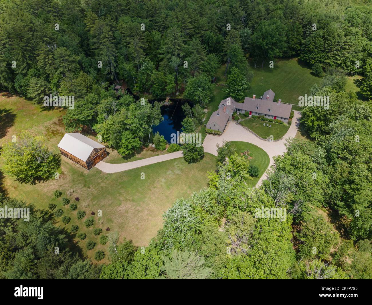 An areal shot of buildings surrounded by greenery in the daylight Stock ...