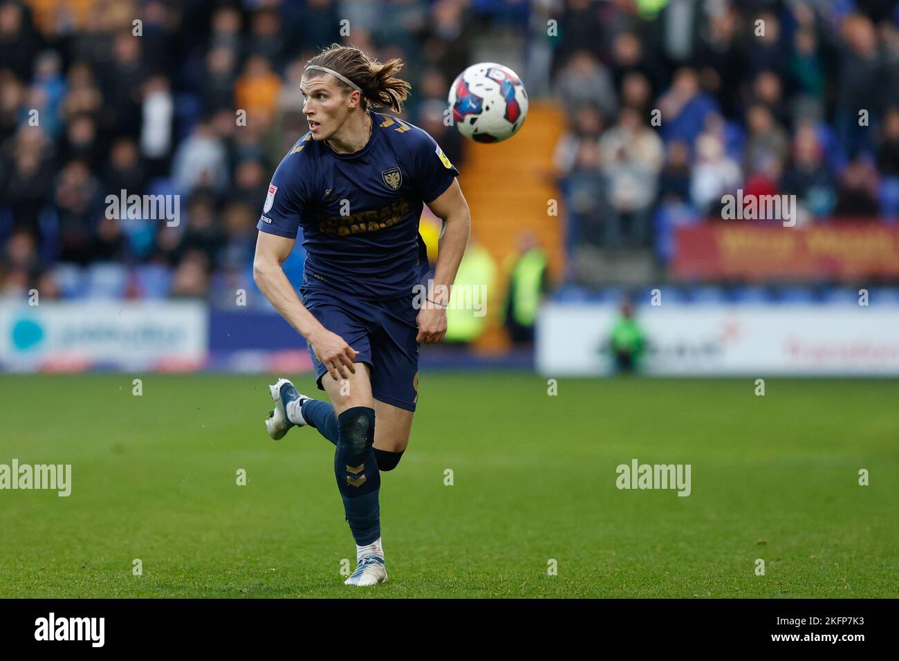 Josh Davison #9 of AFC Wimbledon runs with the ball during the Sky Bet ...