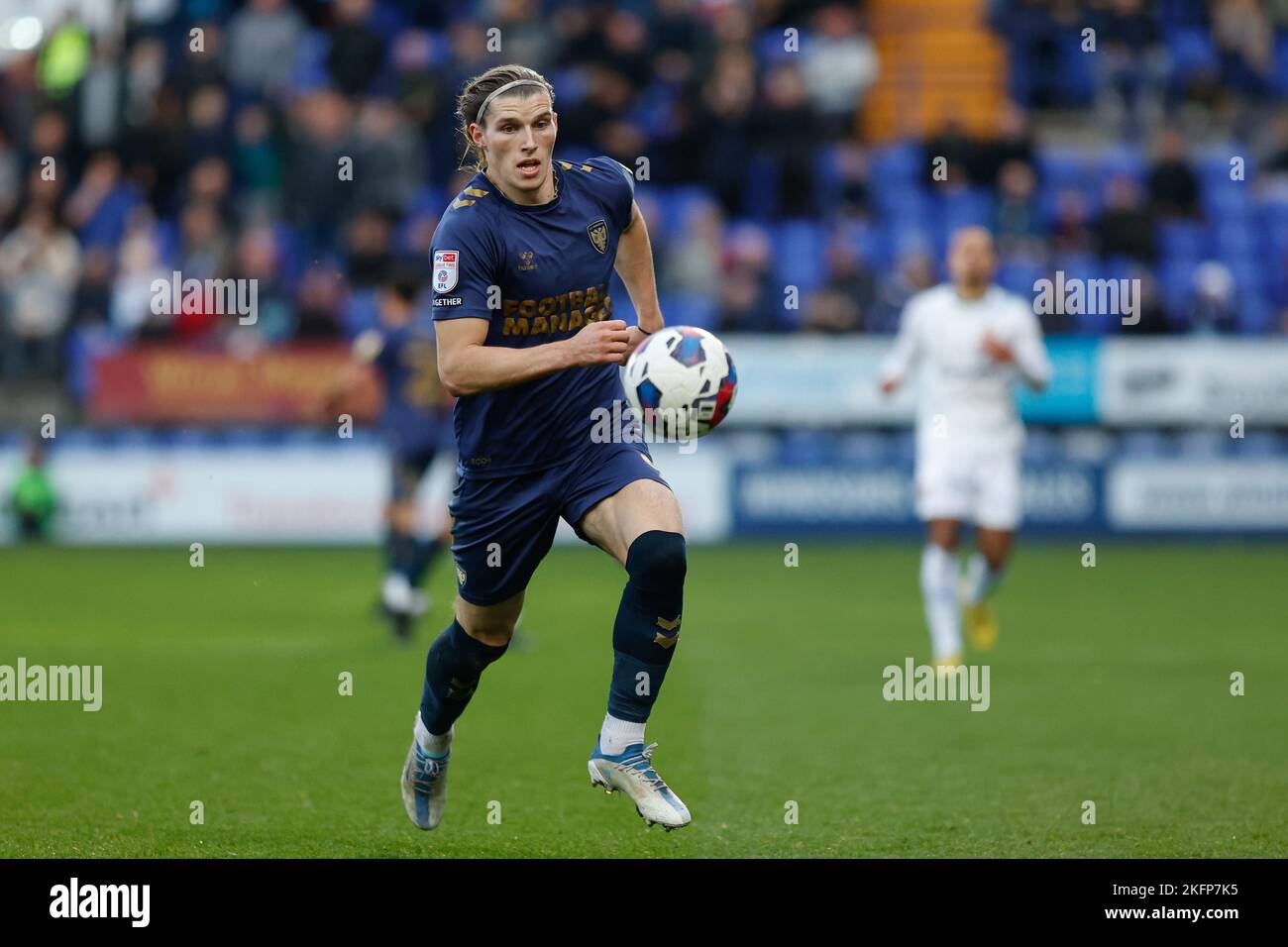 Josh Davison #9 of AFC Wimbledon runs with the ball during the Sky Bet ...