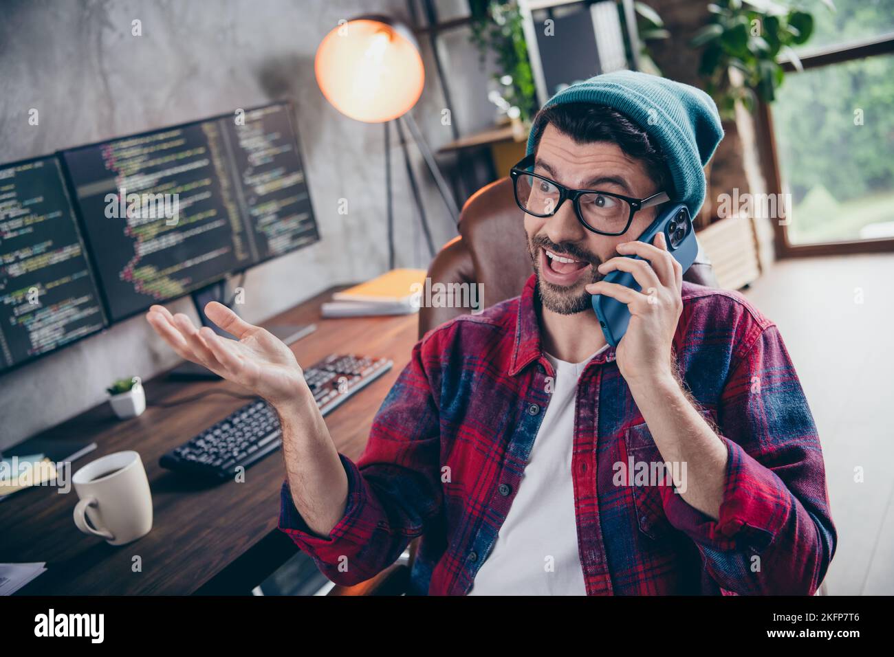 Photo of excited funny guy dressed eyewear communicating modern device ...