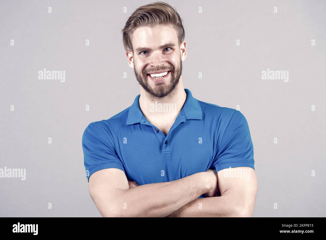 Man happy smile in blue tshirt, fashion Stock Photo - Alamy
