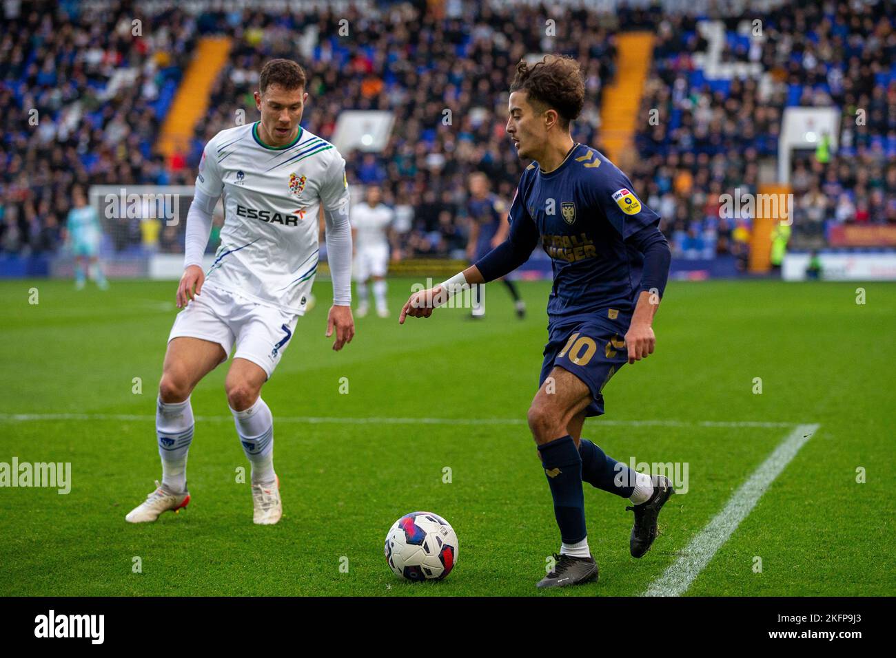 Ayoub Assal #10 of AFC Wimbledon runs at Kieron Morris #7 of Tranmere ...