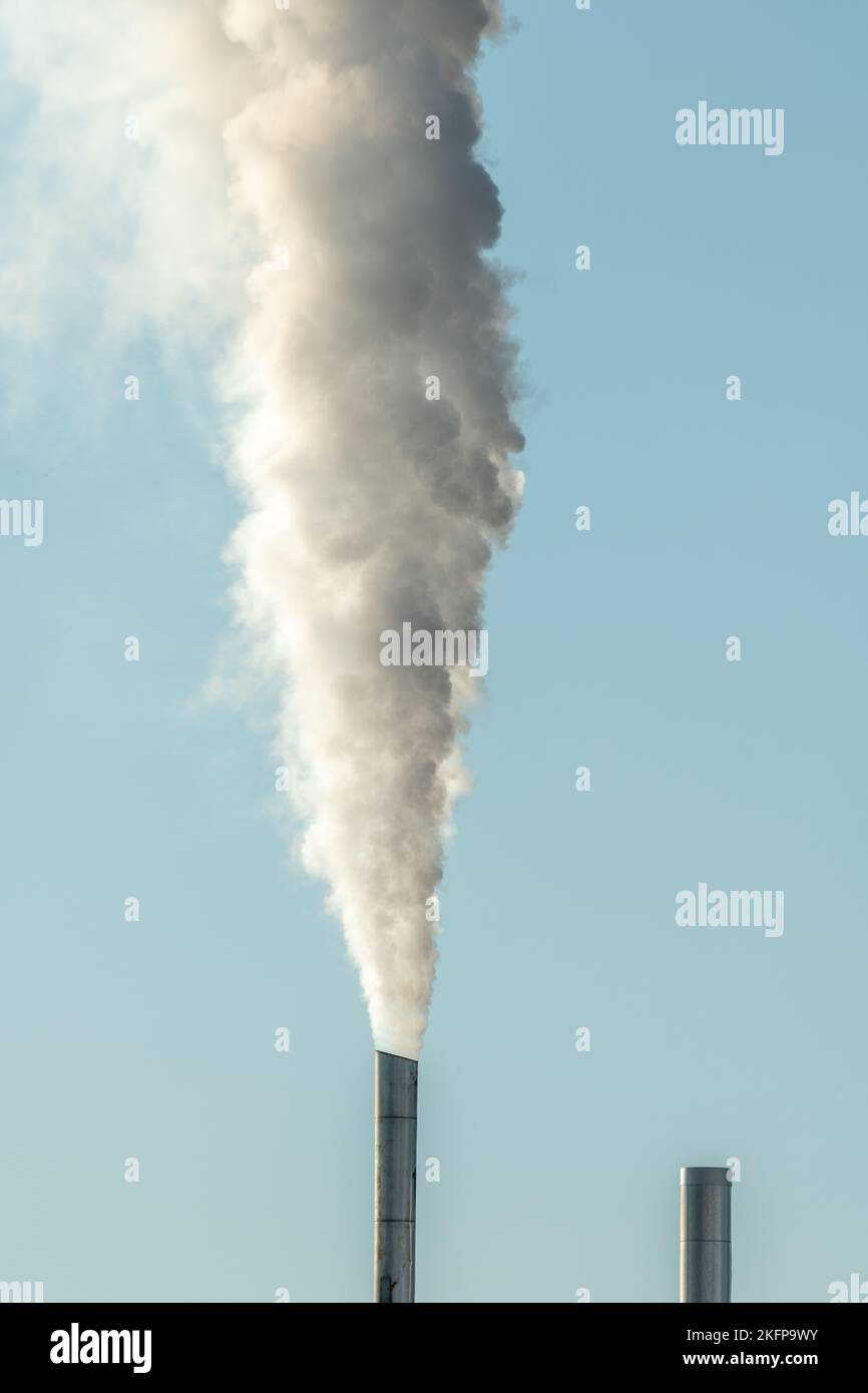 Column of smoke coming out of an industrial chimney. France Stock Photo ...