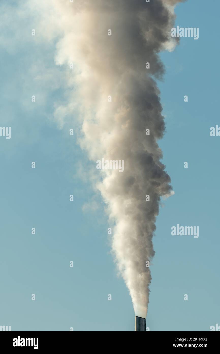 Column of smoke coming out of an industrial chimney. France Stock Photo ...