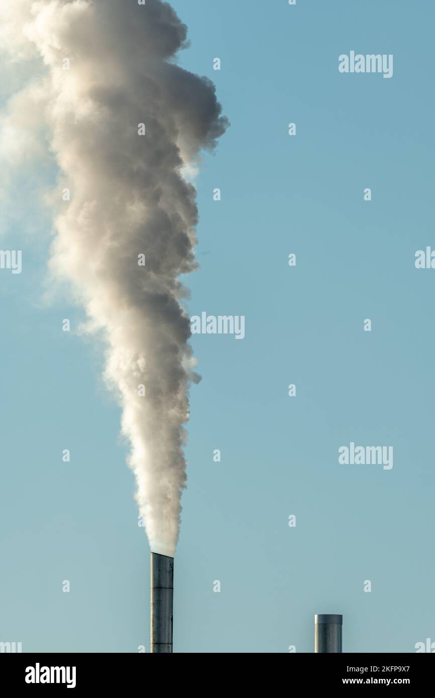 Column of smoke coming out of an industrial chimney. France Stock Photo ...
