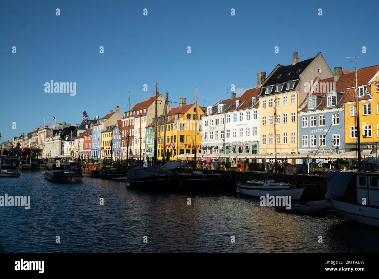The colourful streets of Copenhagen, Denmark, along Nyhavn Quayside, on ...