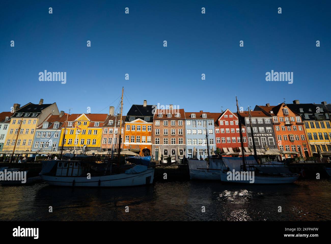 The colourful streets of Copenhagen, Denmark, along Nyhavn Quayside, on ...