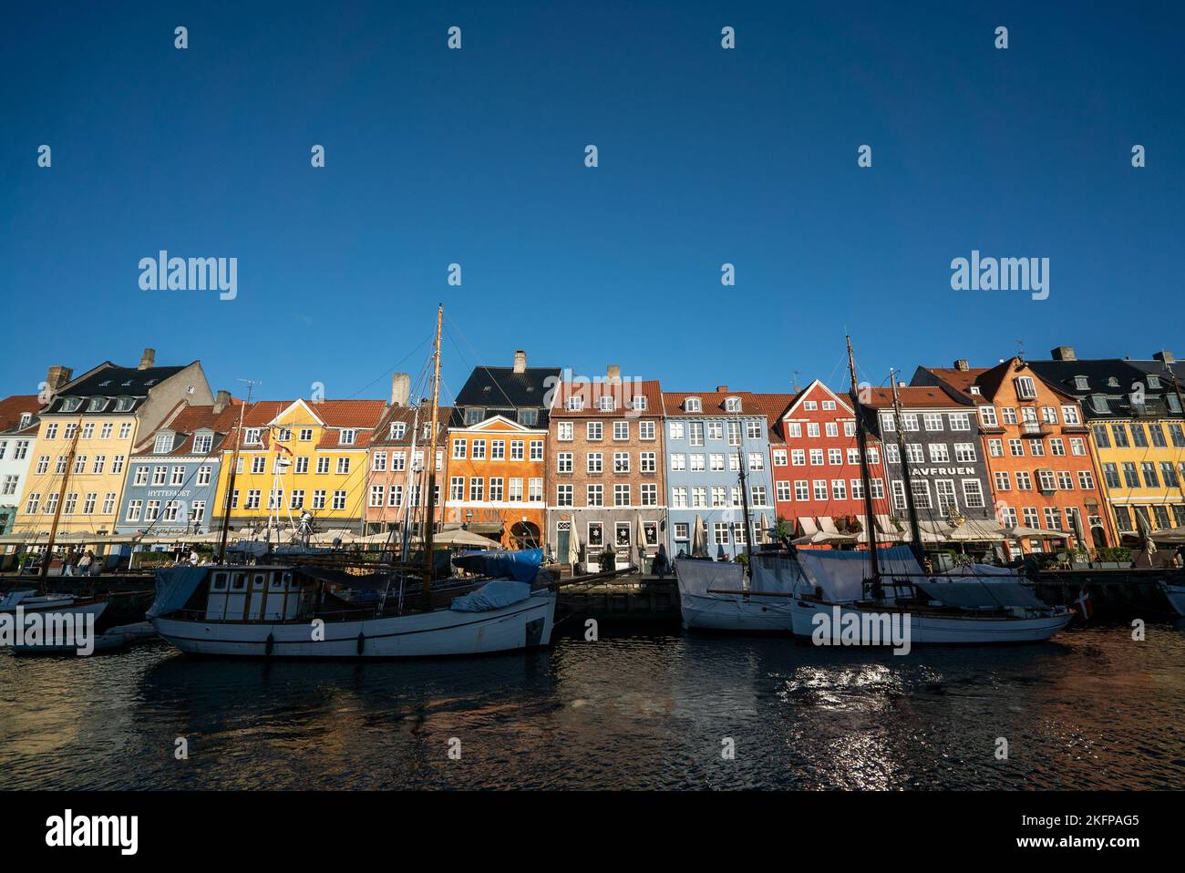 The colourful streets of Copenhagen, Denmark, along Nyhavn Quayside, on ...