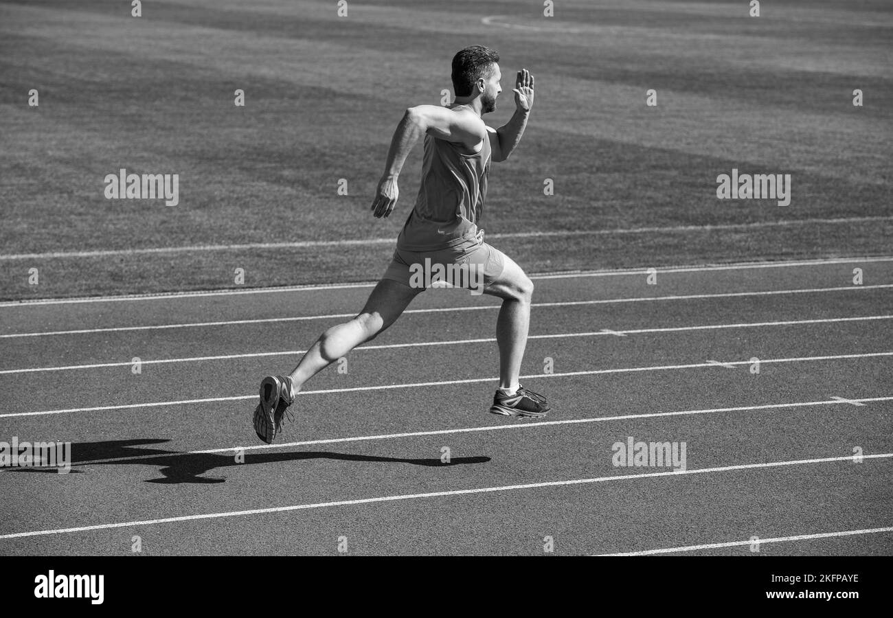 athletic muscular man runner running on stadium, energy Stock Photo - Alamy