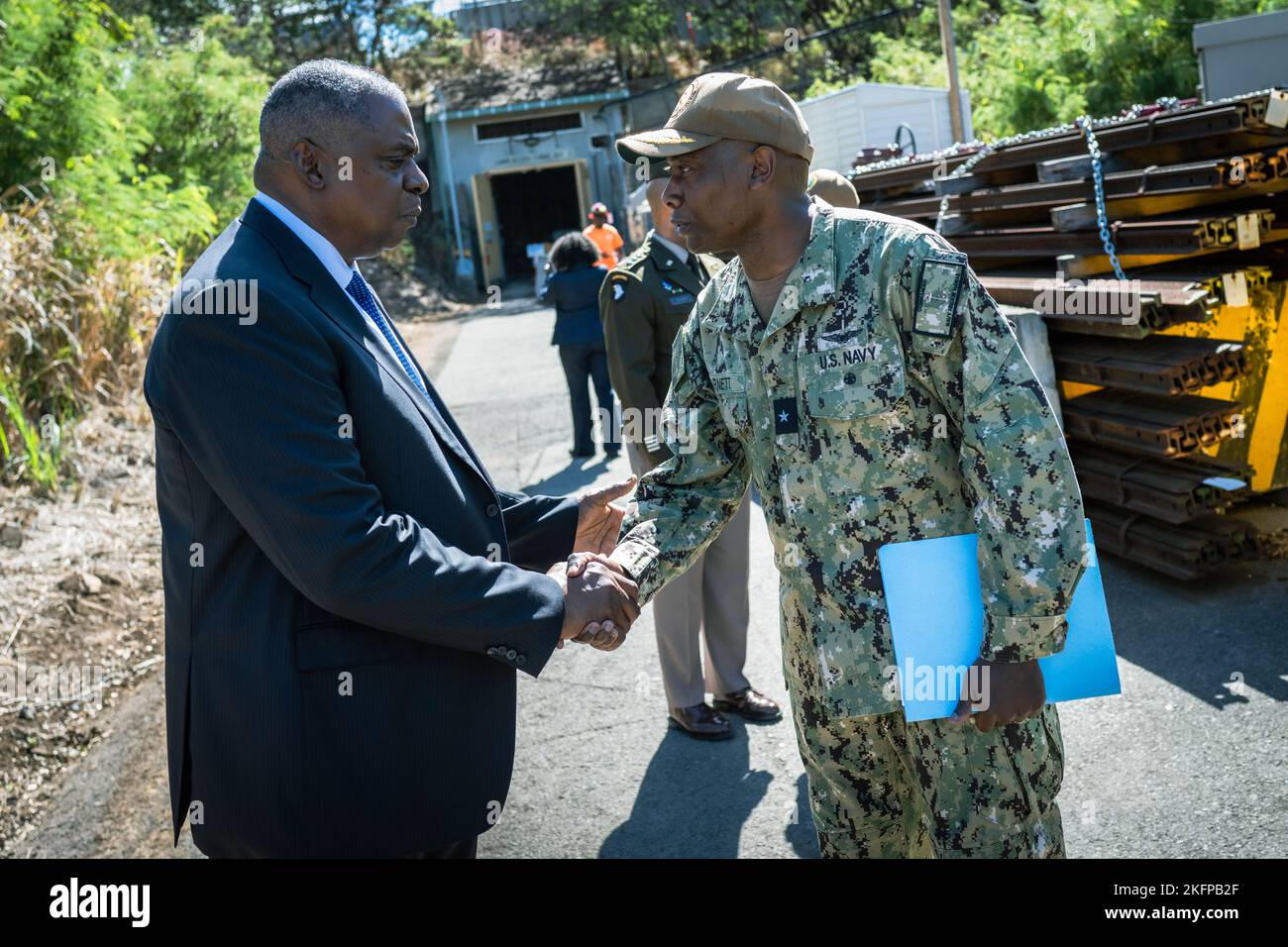 Secretary of Defense Lloyd J. Austin III thanks Rear Adm. Steve Barnett ...