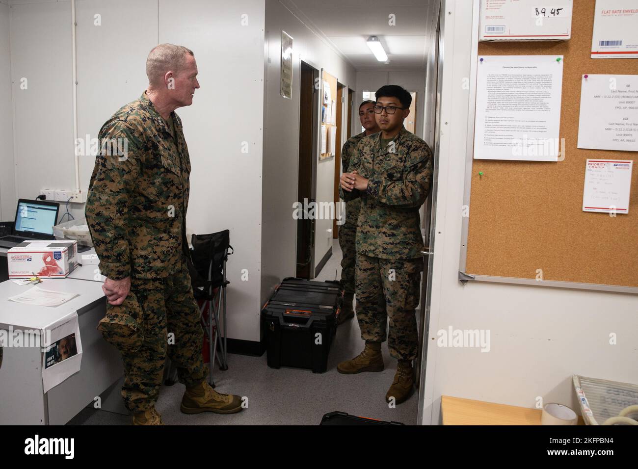 U.S. Marine Corps Cpl. Erik E. Mariano, a postal clerk with the Command ...