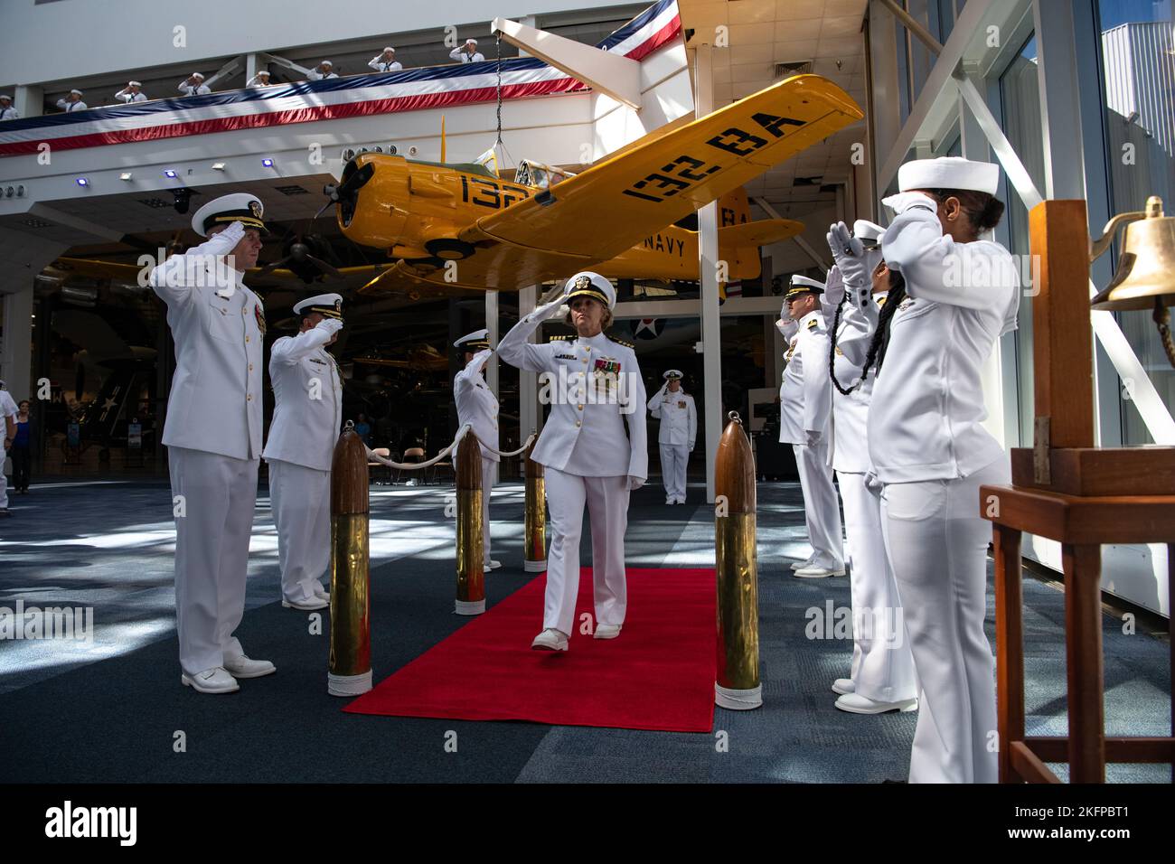 Capt. Kimberly P. Toone is piped aboard during a change of command ...