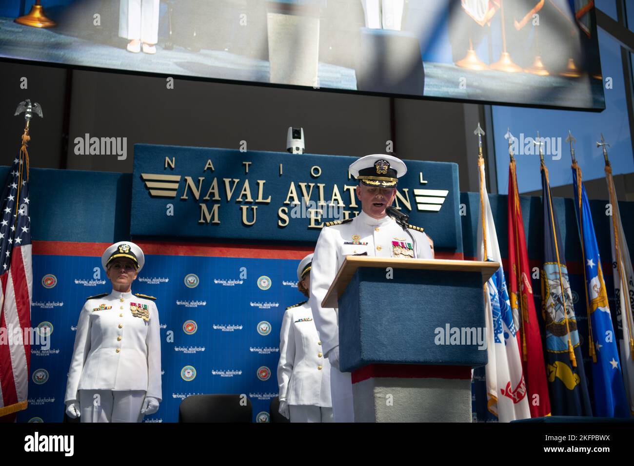 Capt. Matthew W. Hebert reads his orders during a change of command ...