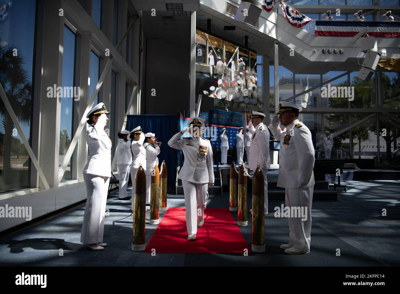 Capt. Kimberly P. Toone is piped ashore as the new commanding officer ...