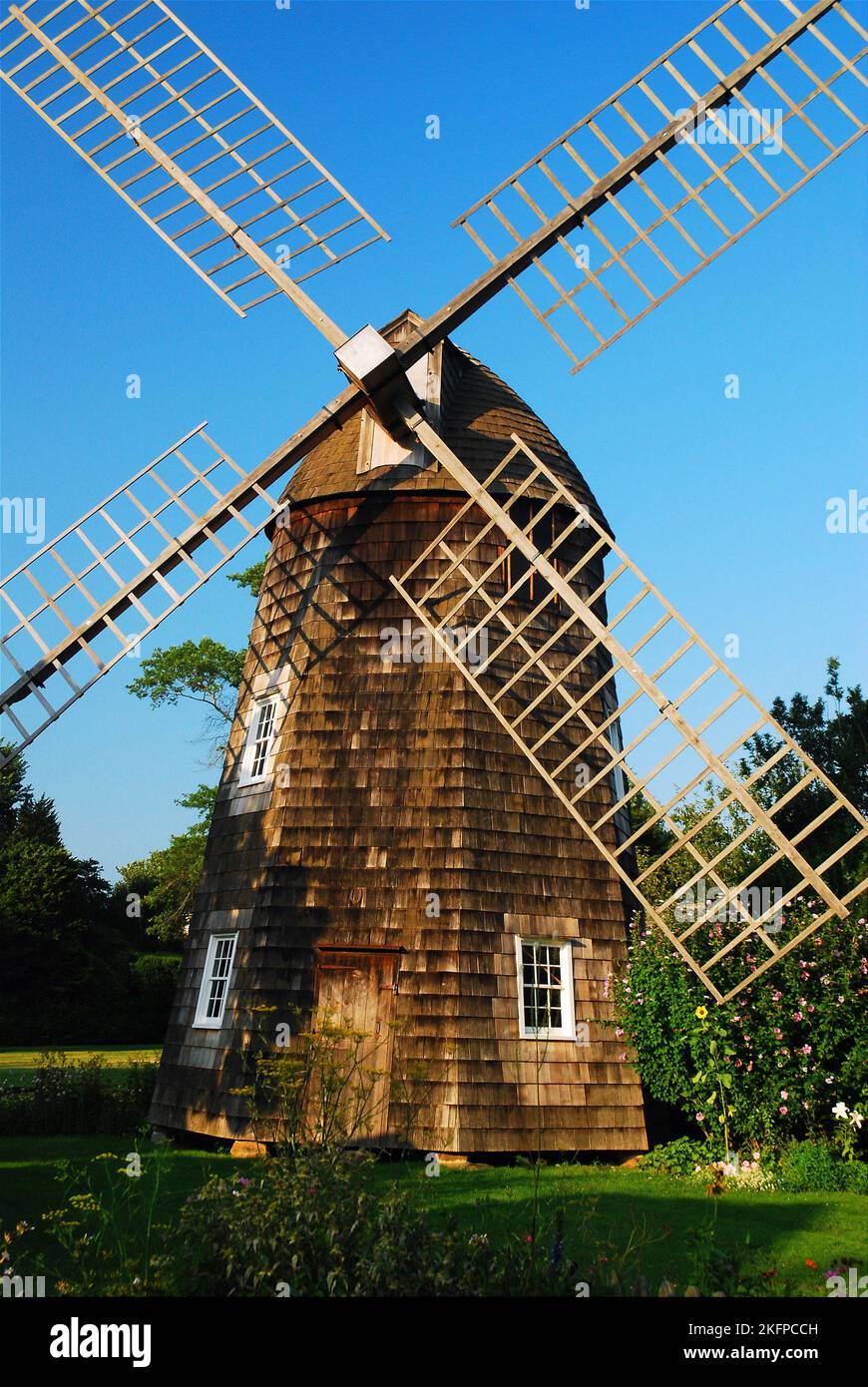 A historic windmill sits on a farm museum, preserving the country farm ...