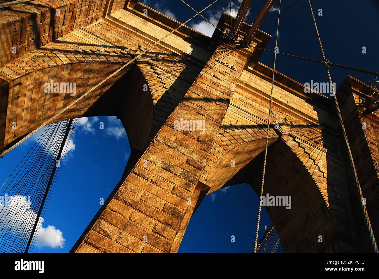 The stone gothic anchor of the famous Brooklyn Bridge in New York City ...