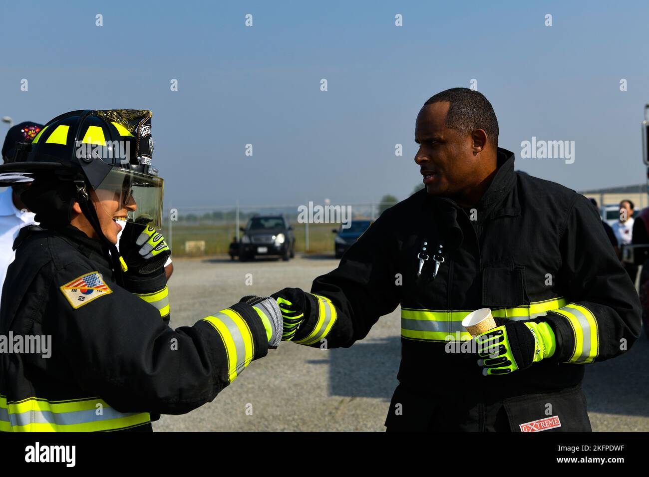 U.S. Army Command Sgt. Maj. Benjamin Lemon (right) fist bumps U.S. Army ...