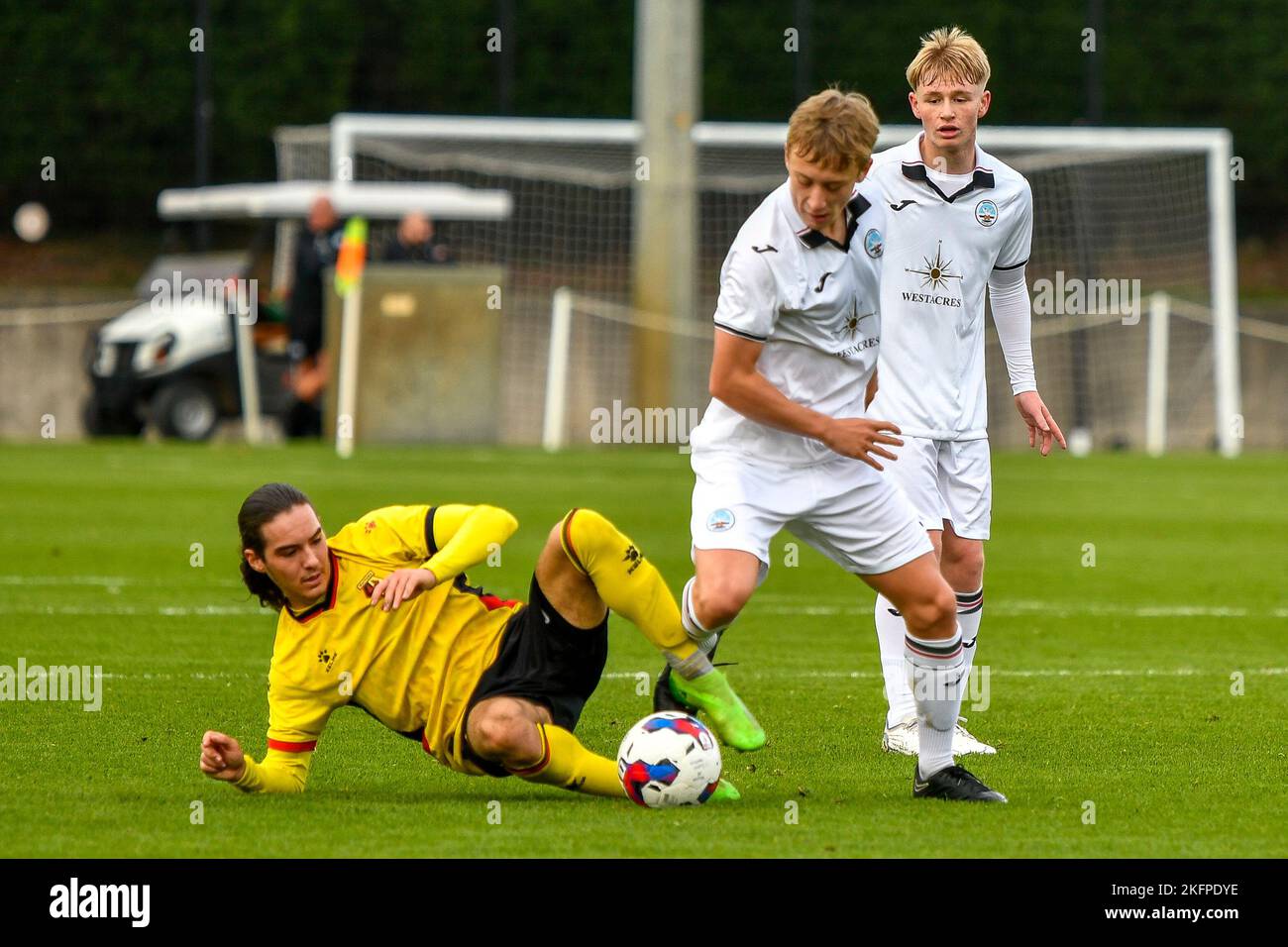 Swansea, Wales. 19 November 2022. Jacob Cook of Swansea City is tackled ...