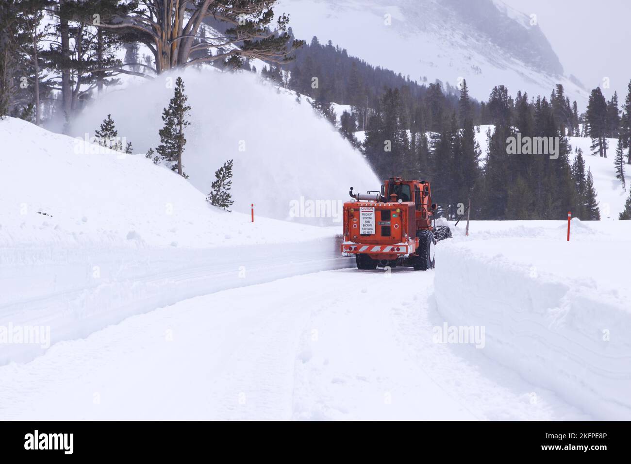 Snowplow clearing a road in the Sierra Nevada mountains of California ...