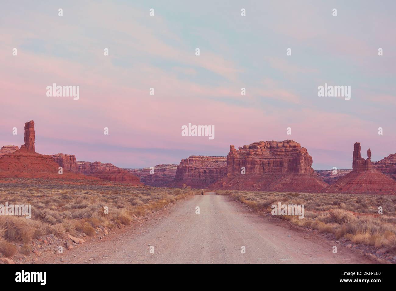 Valley of the Gods rock formation with Monument Valley at sunrise Stock ...