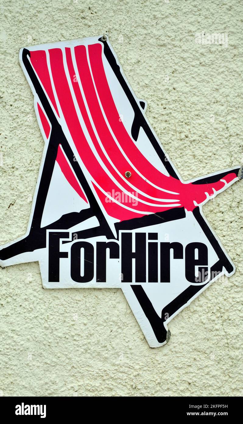 Sign "For hire", with a deckchair image, next to the beach in Saltburn ...