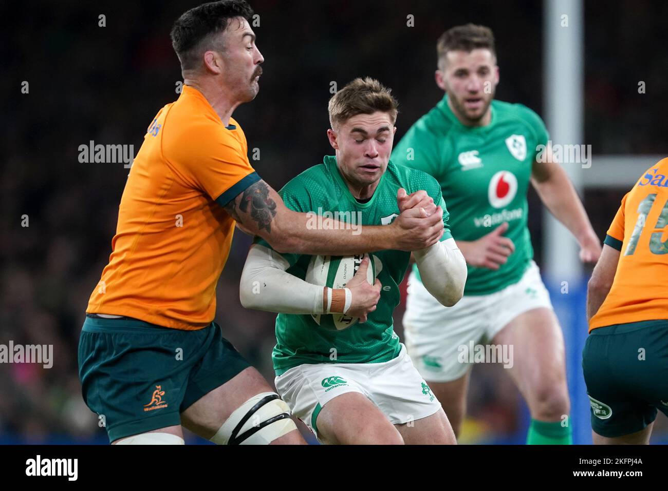 Ireland's Jack Crowley (centre) battles with Australia's Cadeyrn ...