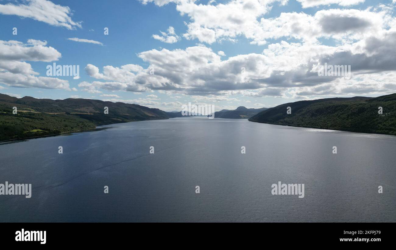 An aerial view of Loch Ness under blue cloudy sky in the Scottish ...